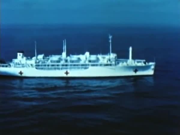 A helicopter brings a wounded soldier aboard the hospital ship USS ...