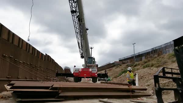 2010s - Construction workers are seen constructing a building on a US ...