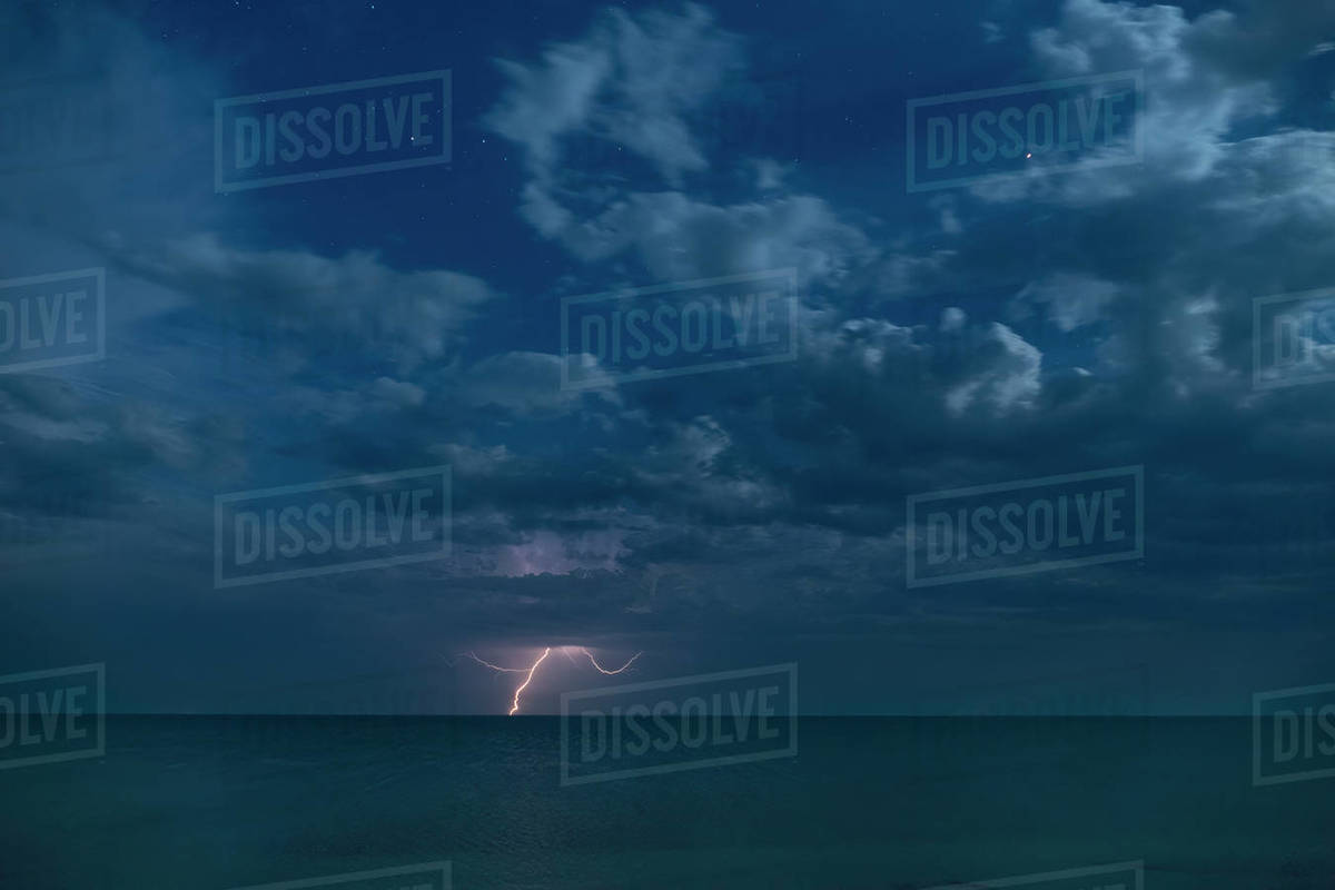 Lightning over water. Electric discharge. Nature background for design ...