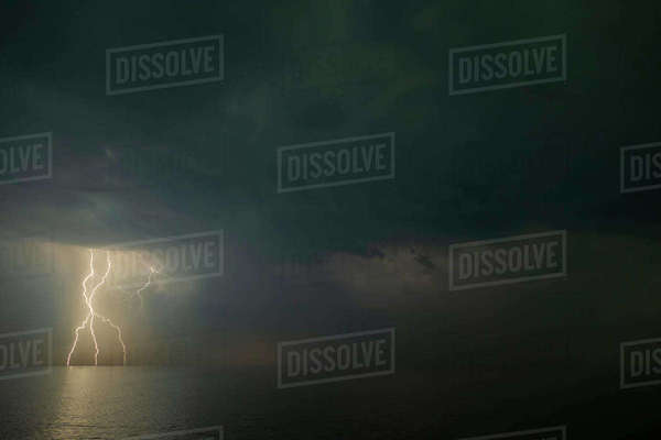 Lightning over water. Electric discharge. Nature background for design ...