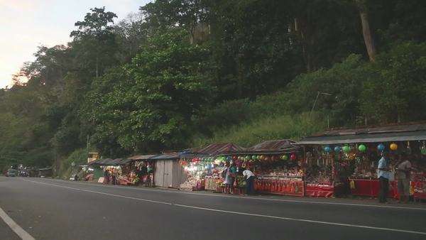 KANDY, SRI LANKA - FEBRUARY 2014: Road to Kandy with many street stalls ...