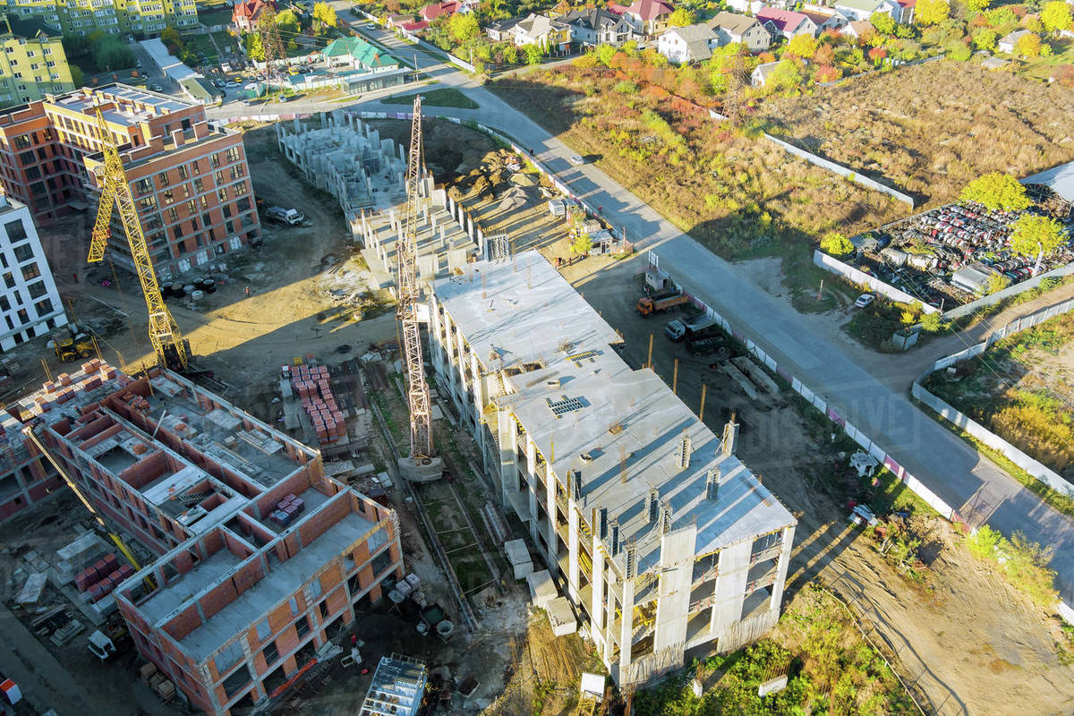 Panoramic top view with high-rise crane under construction against ...