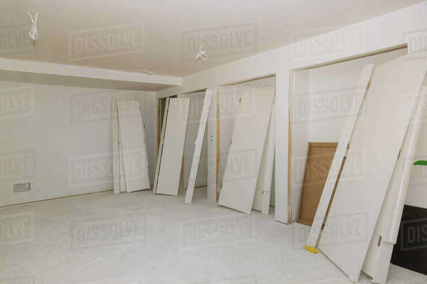 Preparation of interior in new home interior wooden stacker doors a ...