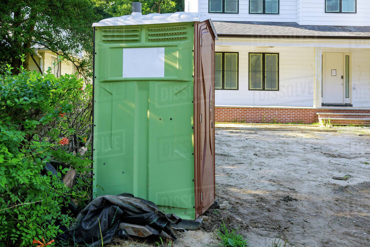 Portable restroom on house under construction in a new house - Royalty ...