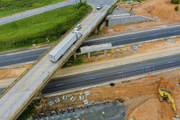Overhead view of under construction works in highways of a bridge over ...