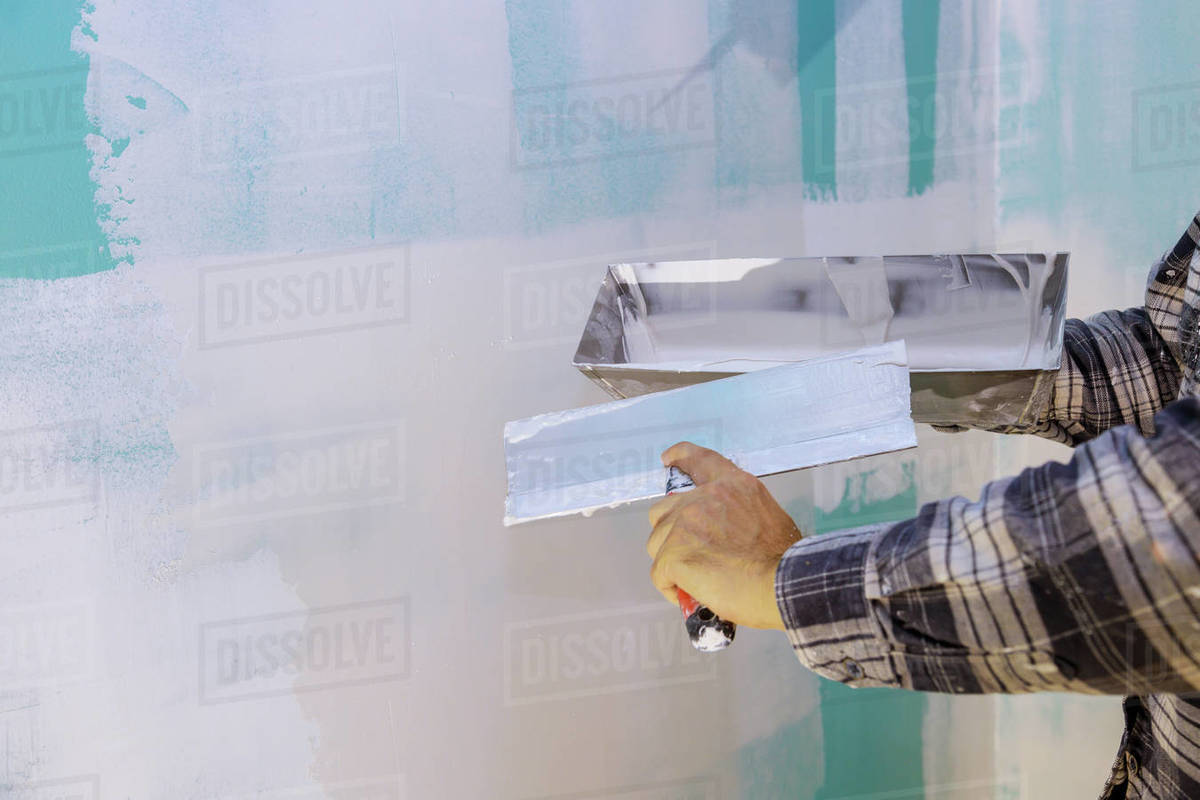 Work hand tool wall using plastering tool for unfinishing wall ...