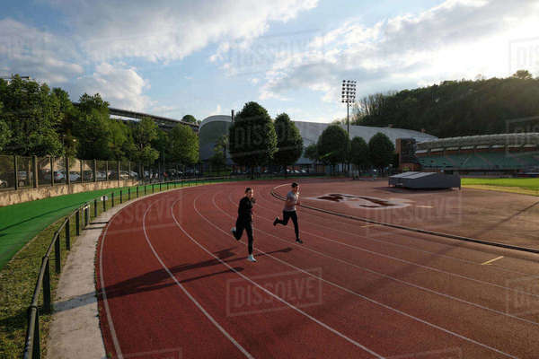 two young adult athletes competing against each other to win a friendly ...