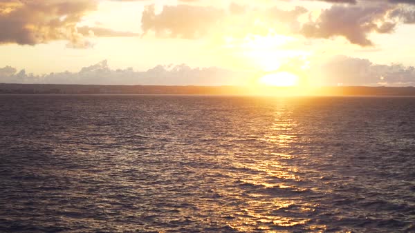 Bright sunset with large yellow sun under the sea surface - Stock Video ...