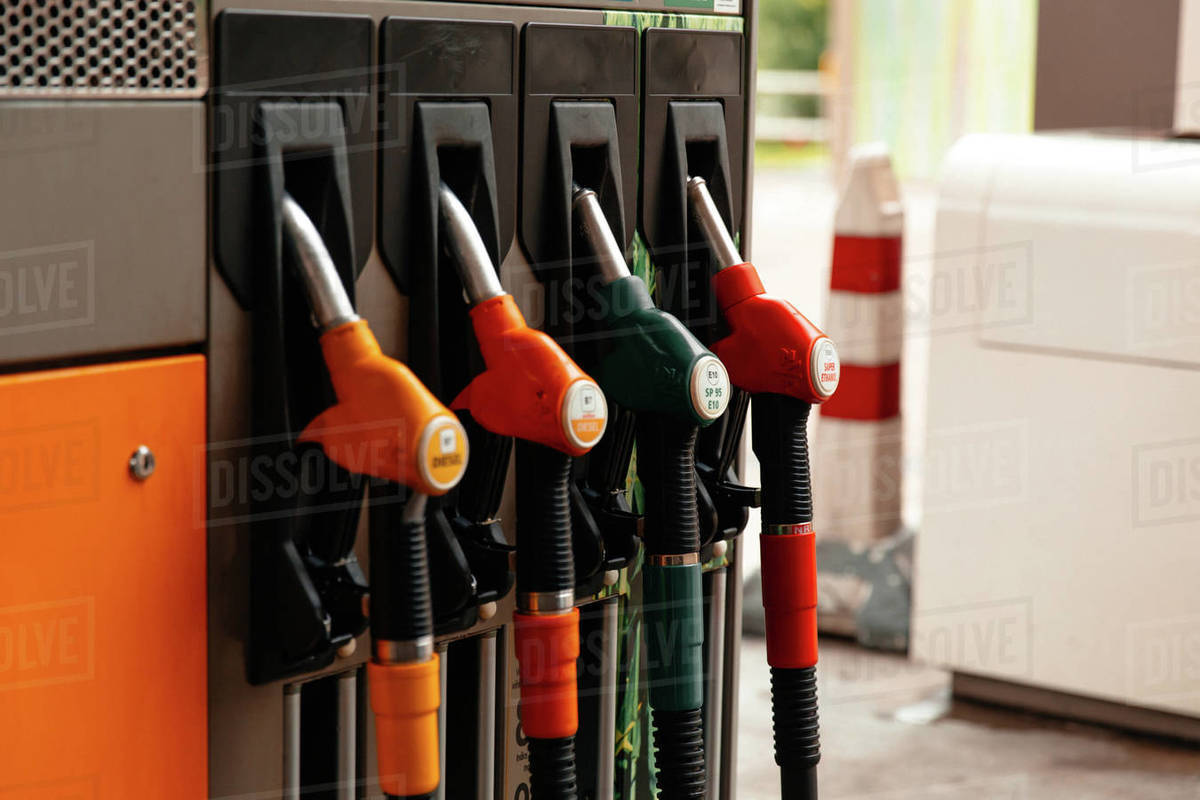 Horizontal shot of some fuel pumps at a gas station. Fuel dispensing ...