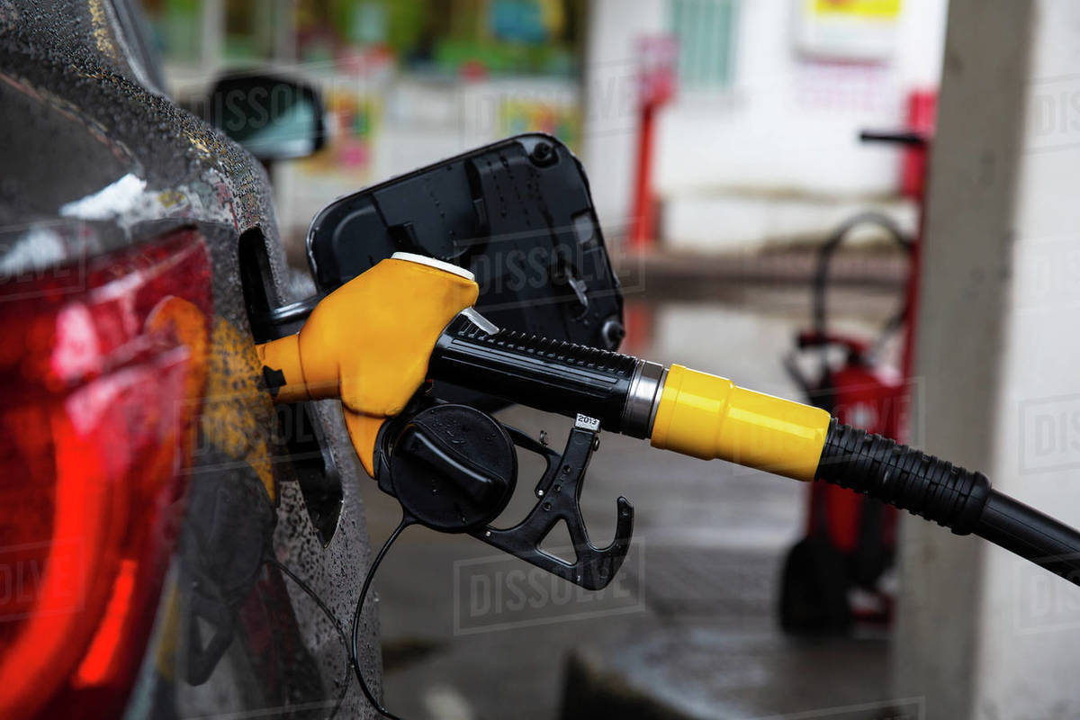 Pumping gasoline fuel in car at gas station. Refueling automobile with ...