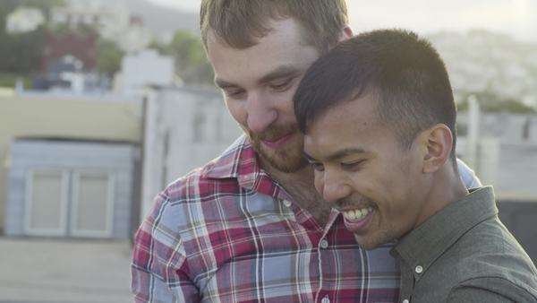 Cute gay couple pose for selfie with a kiss on the cheek - Stock Video ...