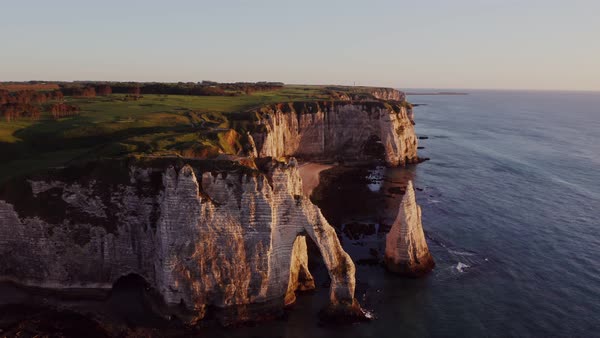 Beautiful coastal cliffs of bizarre shapes with natural arches and wild ...