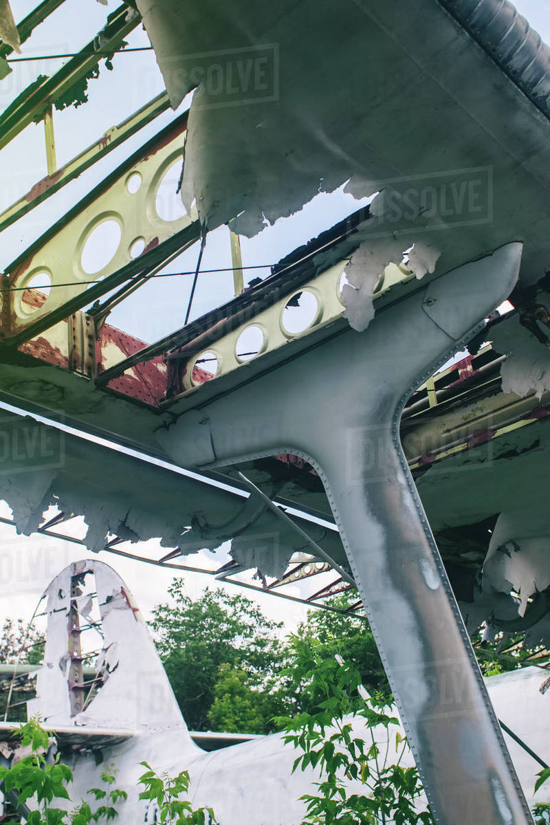Close-up of a crashed airplane wing. The metal frame and internal parts ...