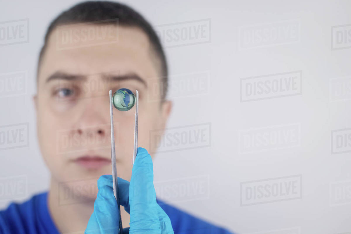Conceptual shot of an eye crystalline lens replacement. Ophthalmic ...
