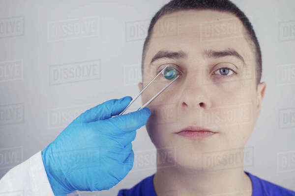 Conceptual shot of an eye crystalline lens replacement. Ophthalmic ...
