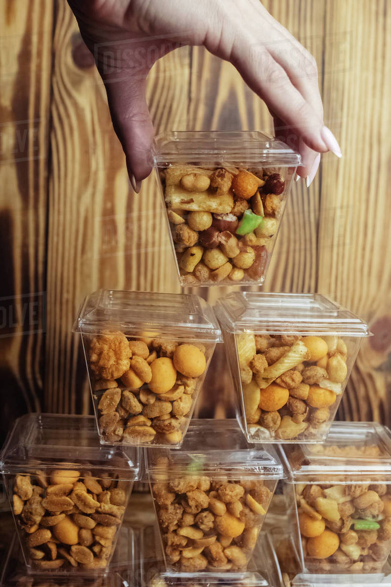 Close-up of a beer snack. Hazelnuts, cashews and peanuts with different ...