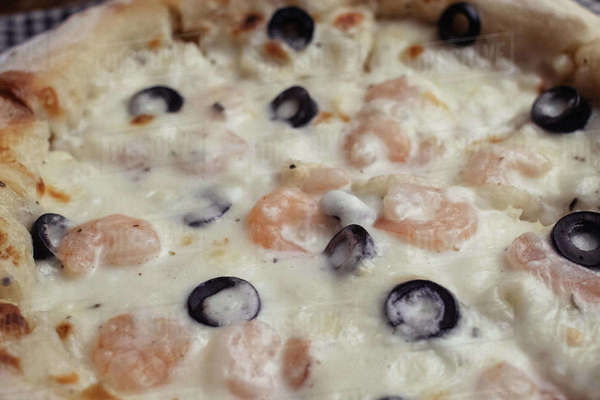 Close-up of pizza with shrimps. Seafood and vegetarian food. Italian ...