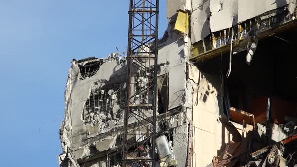 Wrecking ball hitting a building that is being demolished - Stock Video ...