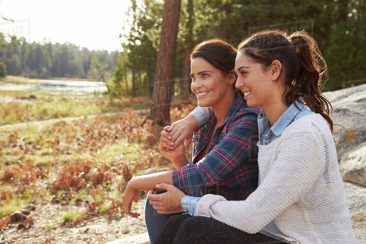Happy lesbian couple relaxing in the countryside - Royalty-free Stock ...