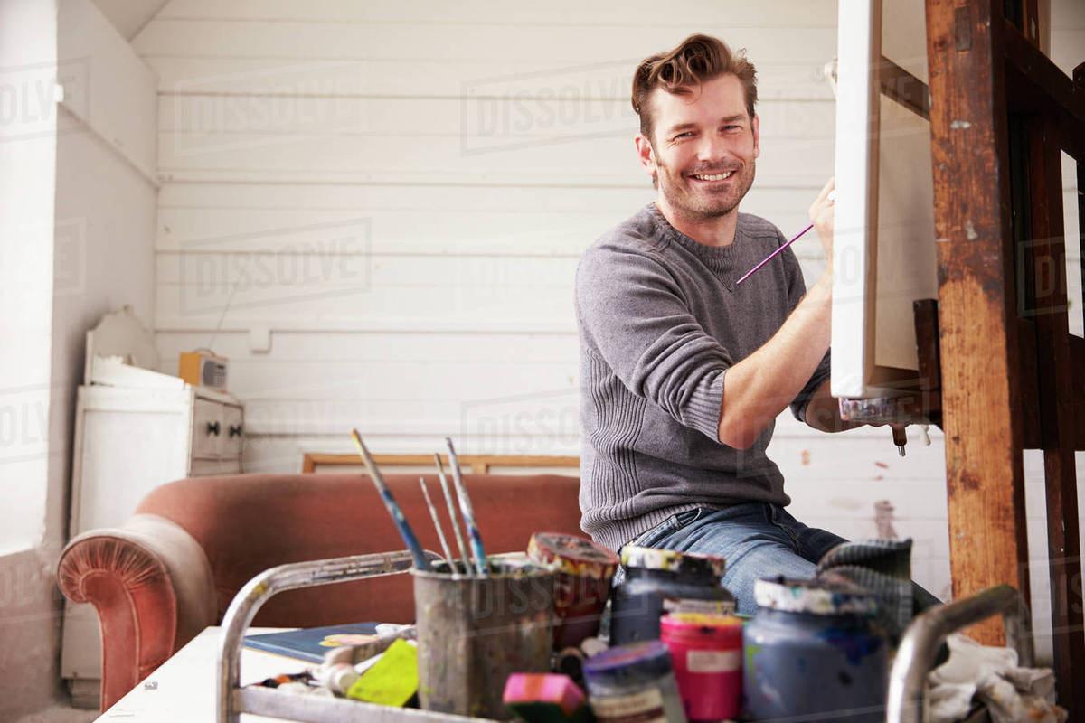 Portrait Of Male Artist Working On Painting In Studio - Stock Photo ...