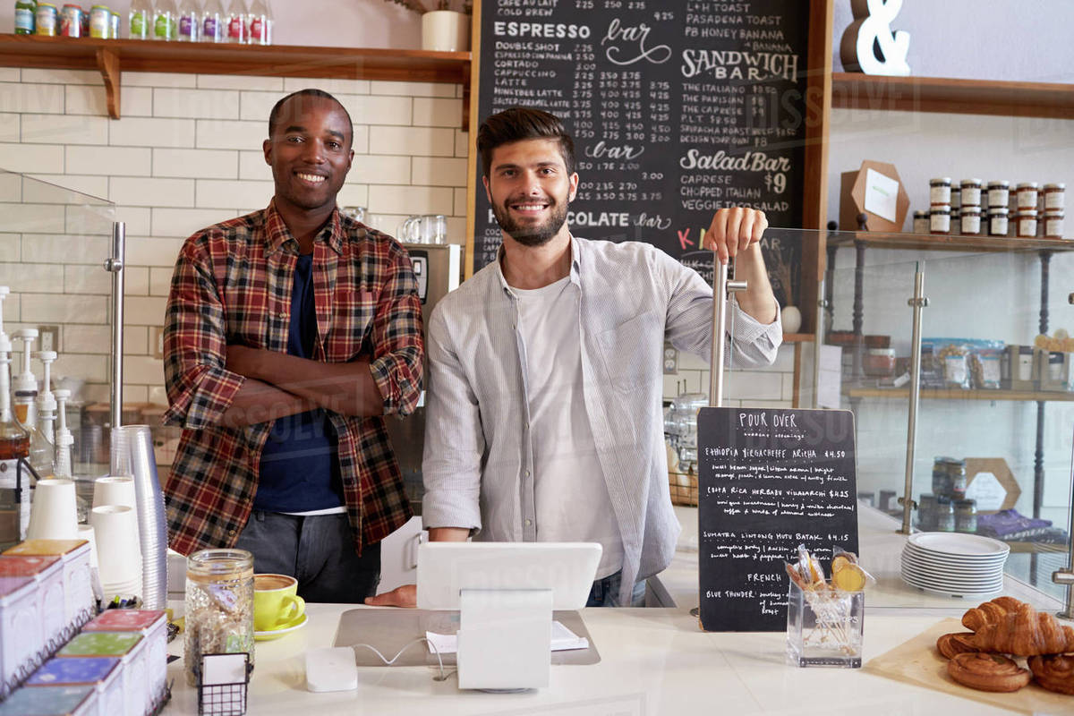 Business partners at the counter of a coffee shop, close up - Royalty ...