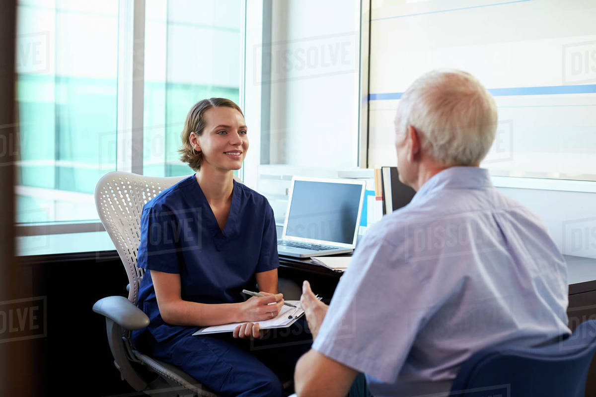 Doctor in consultation with male patient in office - Royalty-free Stock ...