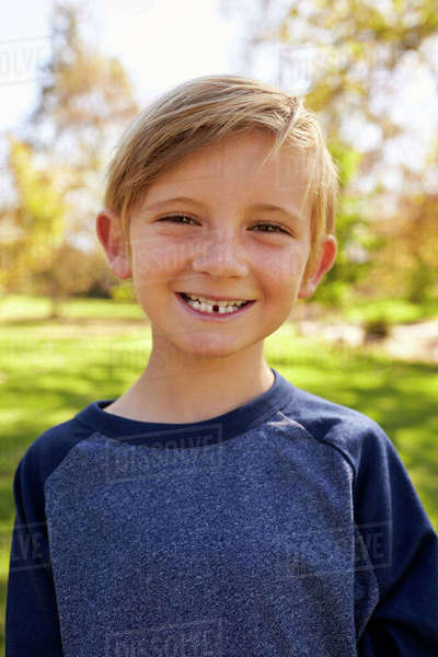 Seven year old Caucasian boy in a park, vertical portrait - Royalty ...