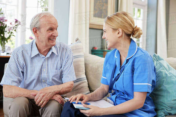 Female Support Worker Visits Senior Man At Home - Royalty-free Stock ...
