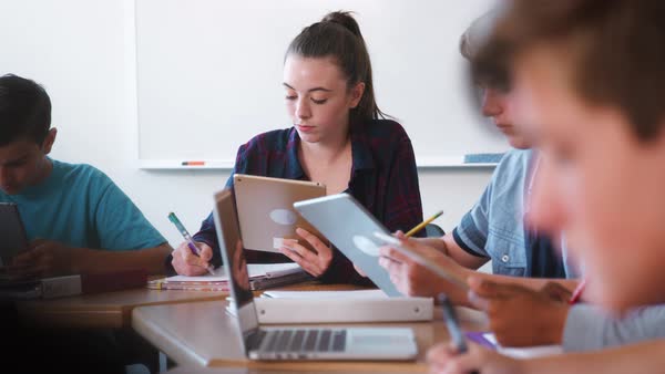 High School Pupils Using Digital Devices In Technology Class Working At ...