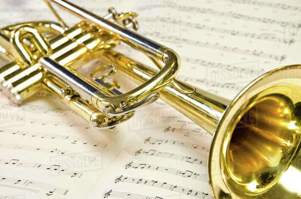 Trumpet on sheet music - Royalty-free Stock Photo | Dissolve