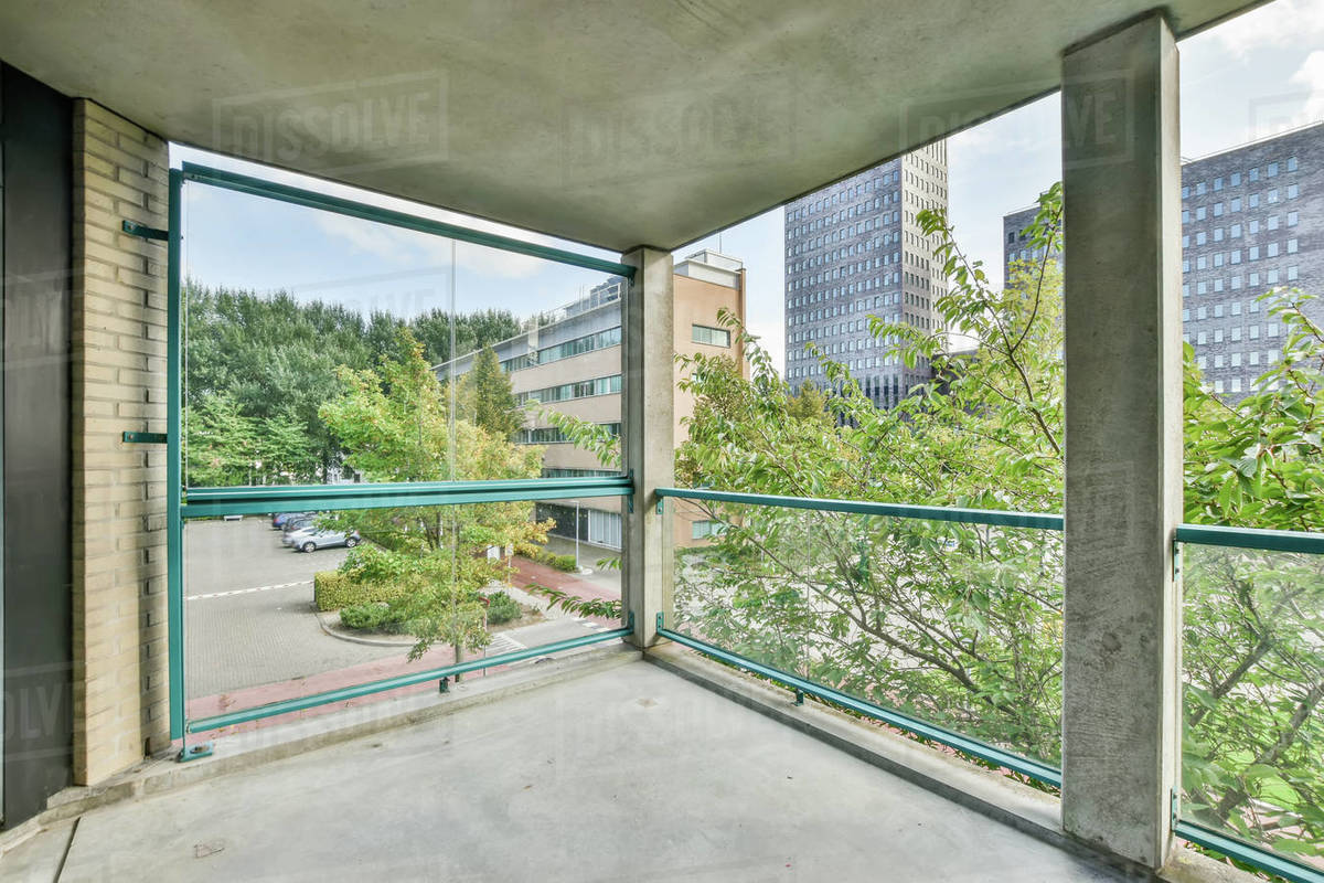 Large concrete balcony with glass railings and amazing view - Royalty ...