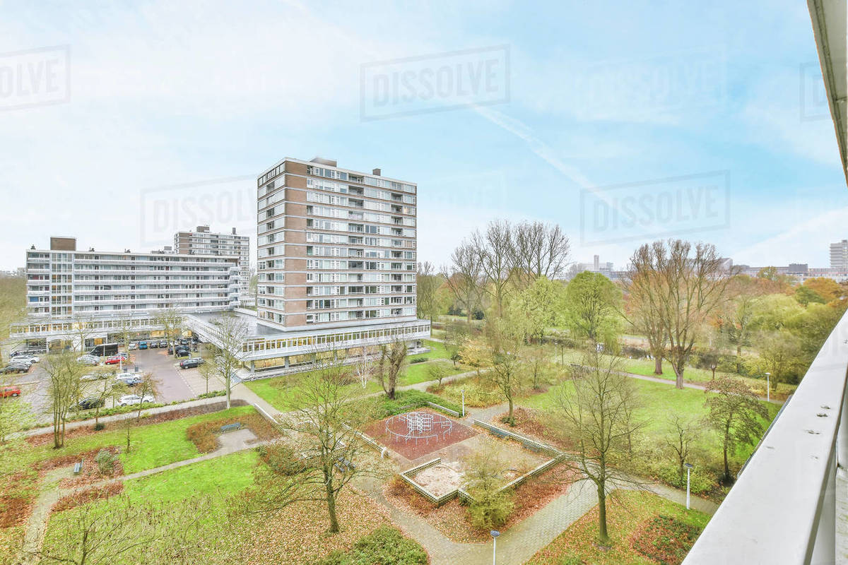 Street view from the balcony to the building and parking - Stock Photo ...