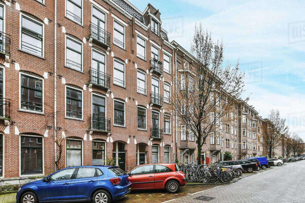 Brick high-rise building with space for parking - Royalty-free Stock ...