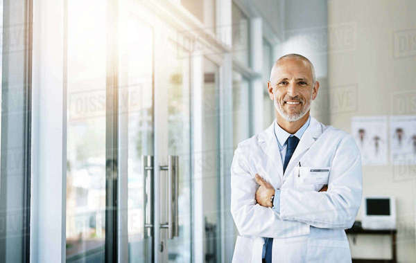Mature doctor, smile and portrait with arms crossed in hospital feeling ...