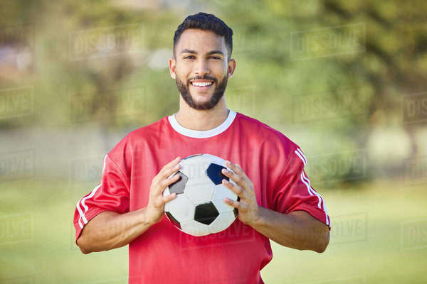 Sports man, soccer player and soccer field training with a soccer ball ...