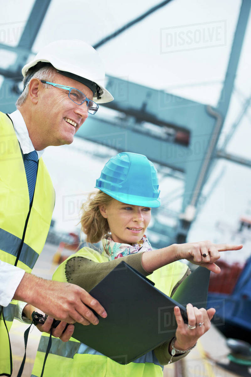 Logistics, teamwork or shipping people with checklist for cargo ...