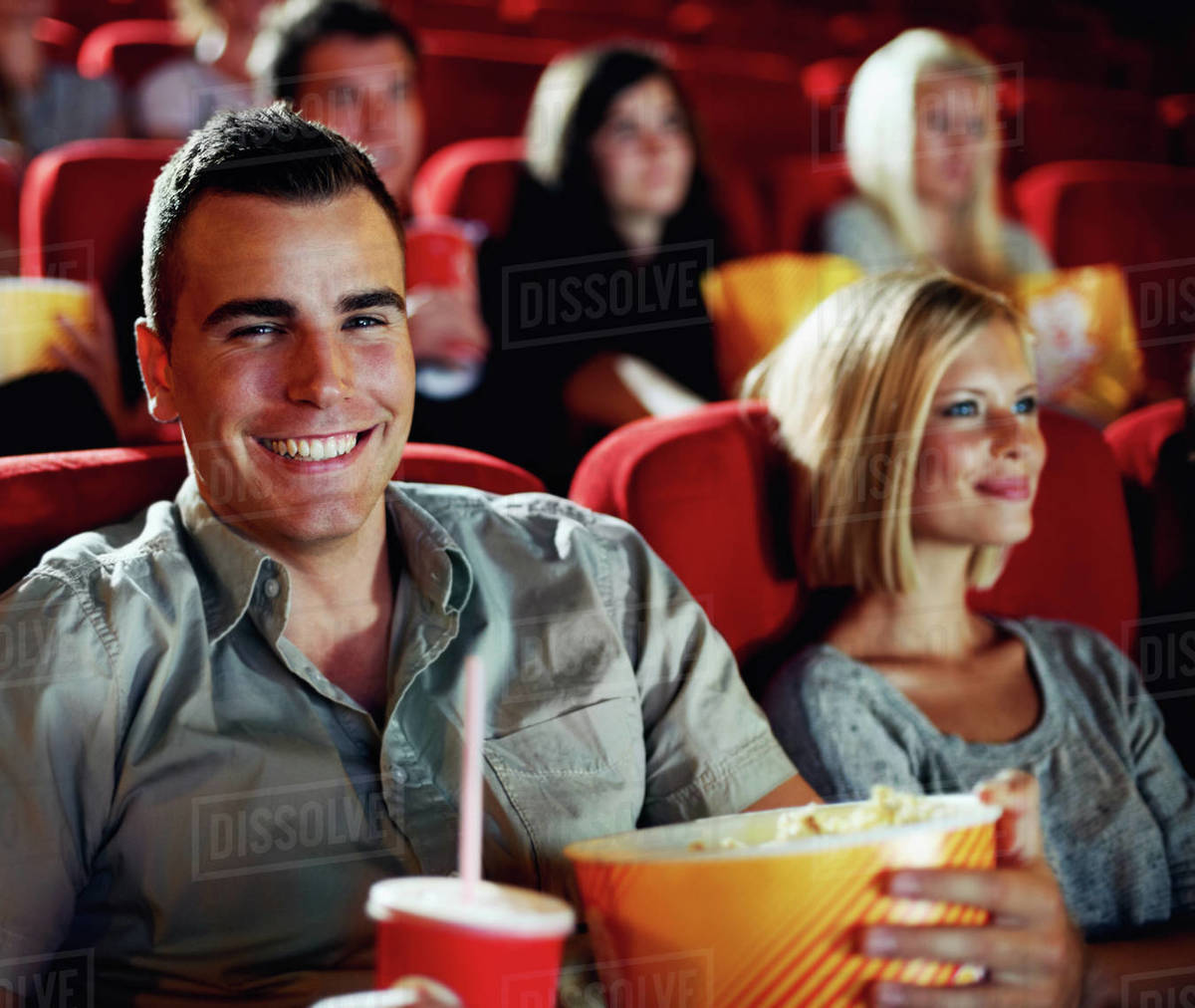 Cinema, portrait and happy couple with popcorn, watching film and ...