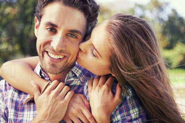 Couple portrait, hug or cheek kiss on love, valentines day or romance ...