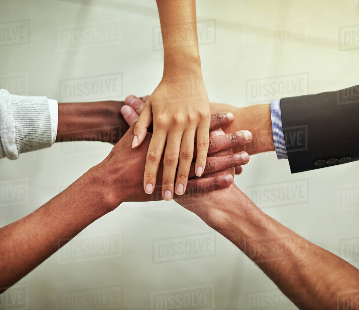Hands of business people stacked together in group for unity, teamwork ...