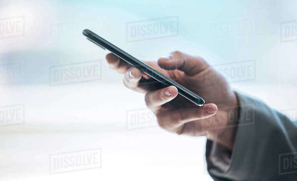 Phone, hand and communication with a business person typing a text ...