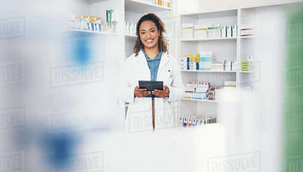 Tablet, pharmacist or portrait of woman in pharmacy with smile in ...