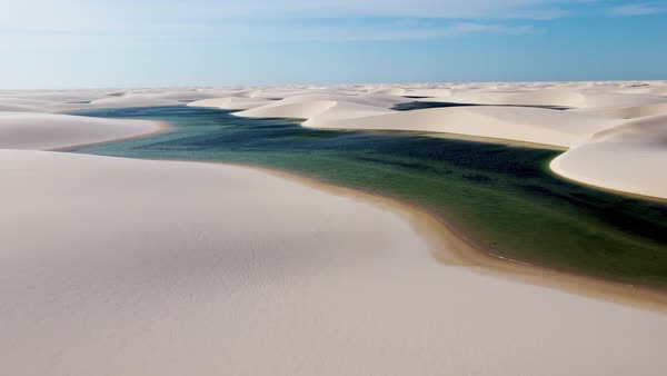 Sand dunes mountains and rain water lagoons at northeast brazilian ...