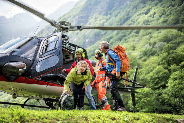 People getting out of the helicopter - Royalty-free Stock Photo | Dissolve