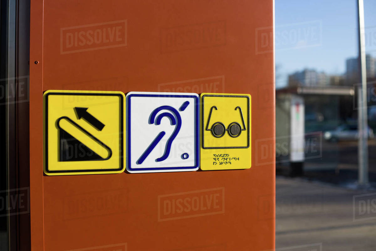 Sign with a symbol of deaf people and blind people with braille text in ...