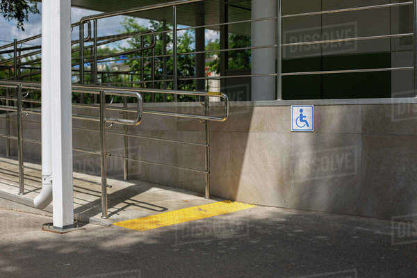 Street ramp for people with disabilities in a wheelchair. Entrance to ...