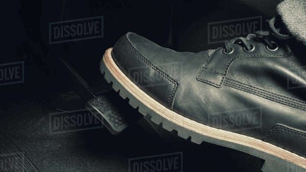 Car accelerate and brake foot pedal. Close up foot press or push foot ...