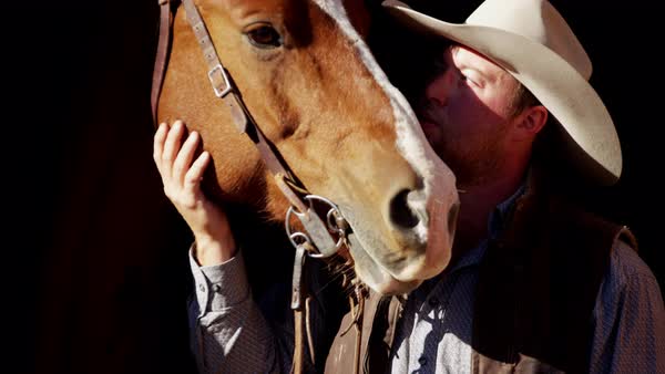 Cowboy Ranch hand with horse on Dude Ranch in Corral USA - 4K Royalty ...