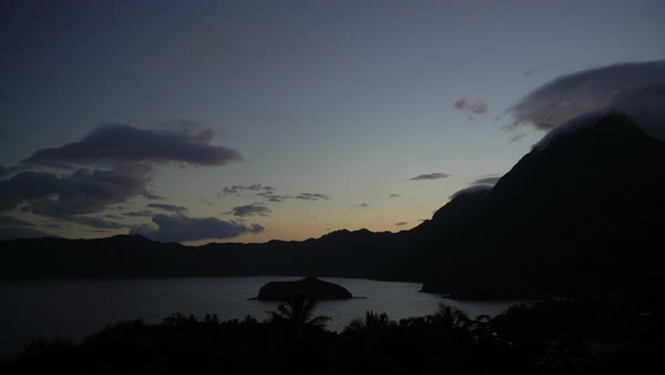 Atuona Hiva Oa ocean bay sunrise built structure mountains in a remote ...