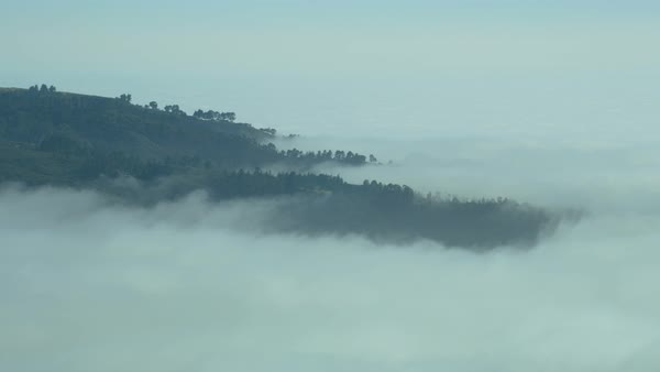 Aerial view dense sea fog around Big Sur coastal mountain ranges ...