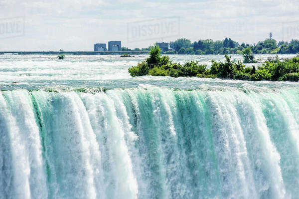 Dangerous rapids falling over edge at top of Horeshoe Falls at Niagara ...